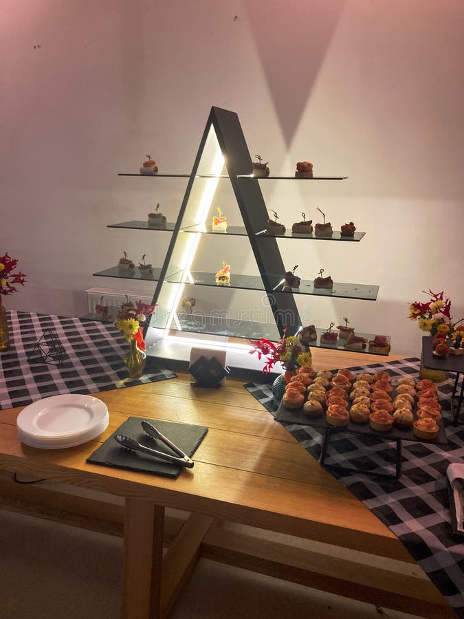 Indoor Photograph of a Three-tiered Dessert Display Case in a Bakery or ...