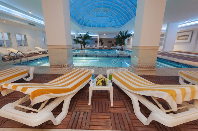 Indoor Pool at a Luxury Hotel Stock Photo - Image of decking, column ...