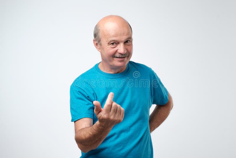 Playful Adult Showing Come Here Gesture with Index Finger and Smiling ... Playful Adult Showing Come Here Gesture with Index Finger and Smiling ...