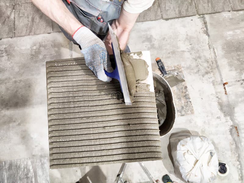Indoor Tile Installation Process with Skilled Worker Applying Adhesive ...
