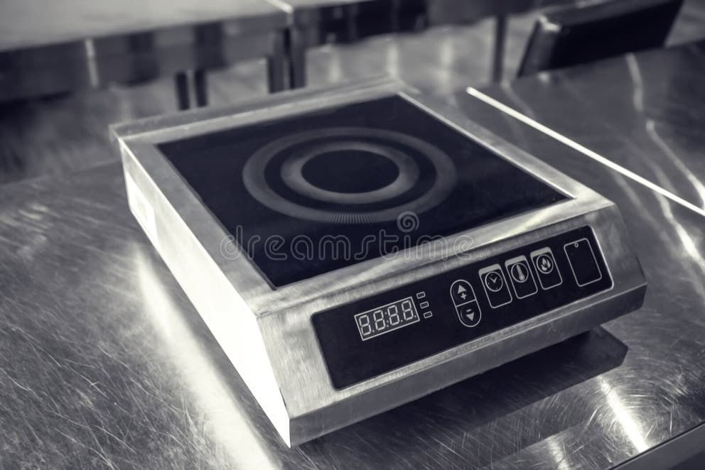 Induction Cooker in Restaurant Kitchen Stock Photo - Image of induction ...