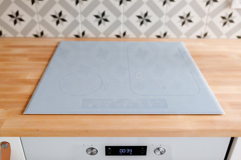 Induction Hob in Electric Kitchen Cooker Stock Photo - Image of plate ...