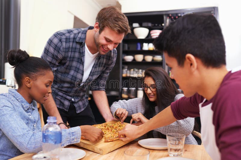 Indulging in Some Yummy Pizza. a Group of Friends Enjoying Pizza ...