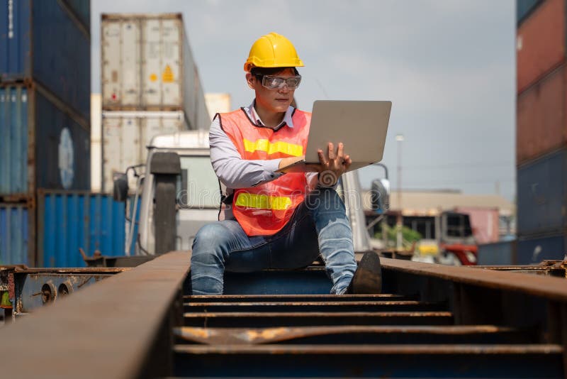 Industrial Asian Containers Yard and Cargo Loading Inspector Working ...