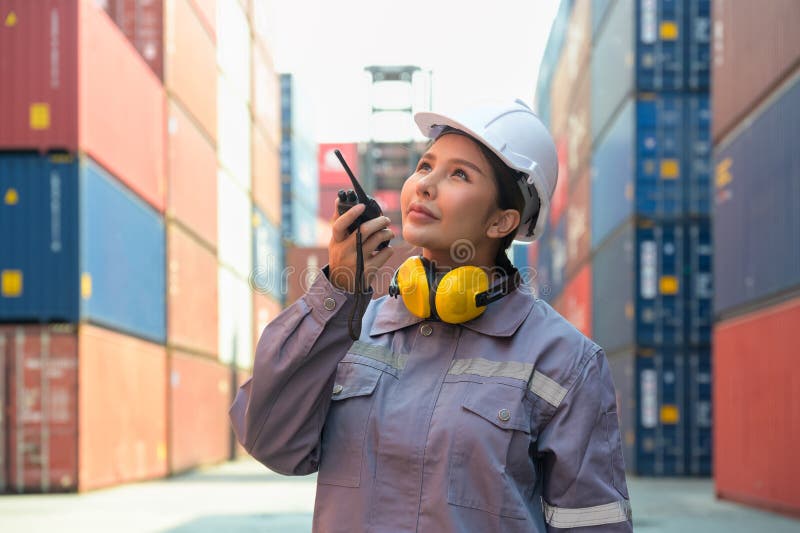 Industrial Asian Female Engineer Checking Containers Using Walkie ...
