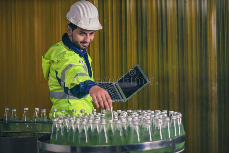 Production Line Supervisor and Worker Work Together in Beverage ...