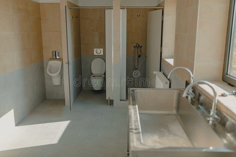 Industrial Bathroom in a Workshop Stock Photo - Image of toilet ...