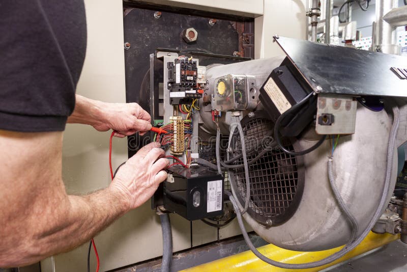 Industrial Boiler Engineer Using a Tester To Check Wiring Stock Photo ...