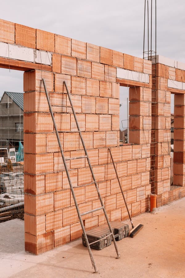 Industrial Bricklayer Installing Bricks on Construction Site Stock ...