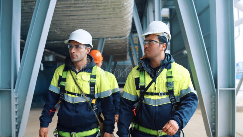 Industrial Builder Group in Protective Helmet Uniform Walking Refinery ...