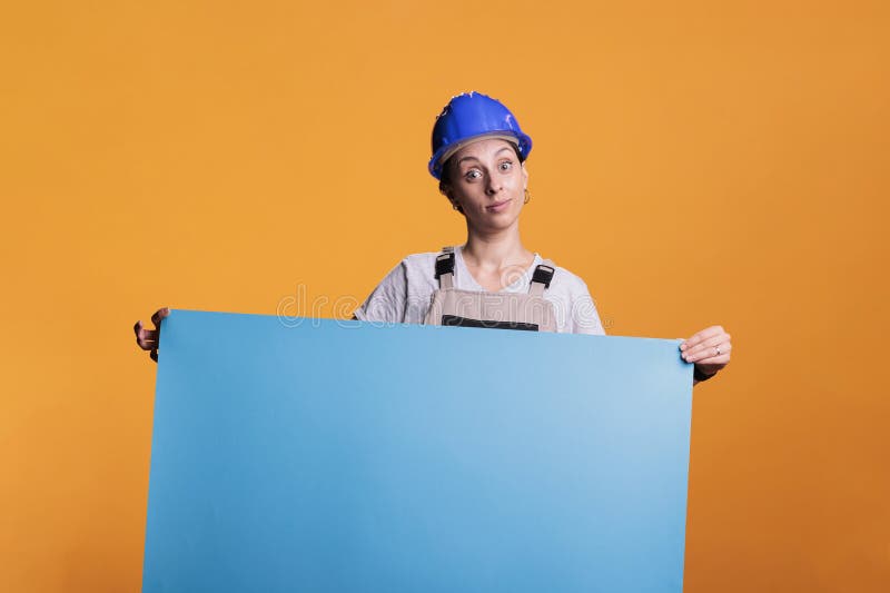 Industrial Builder Holding Blank Cardboard Sign Stock Image - Image of ...