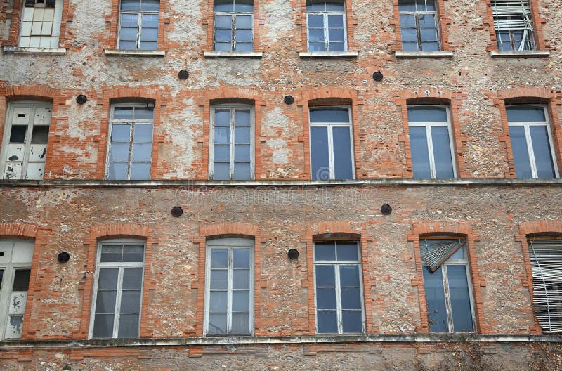 Industrial Building with Facing Bricks and Broken Windows Stock Image ...