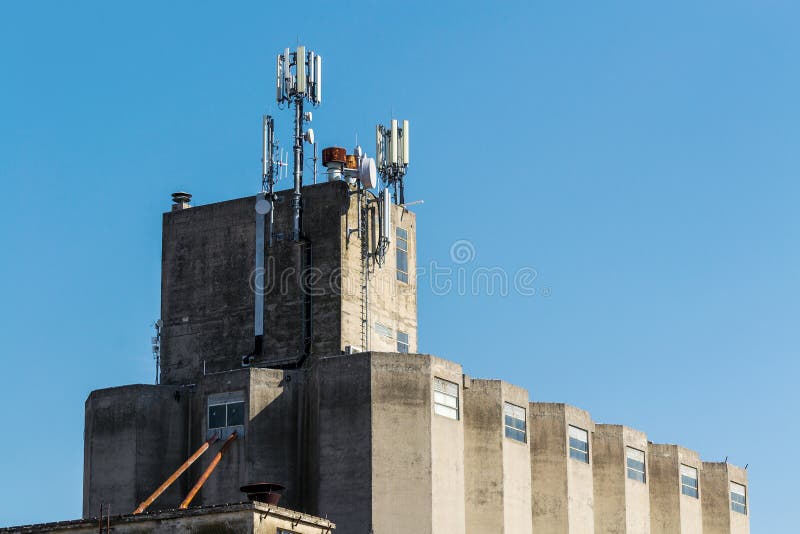 Industrial Building with GSM Antennas on Roof Stock Photo - Image of ...
