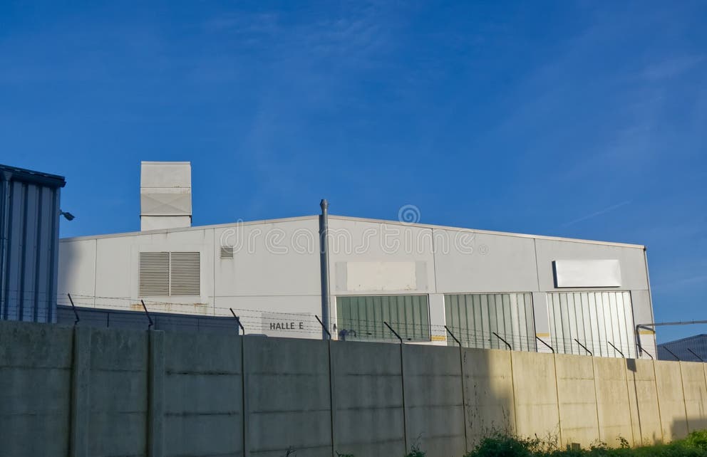 Industrial Building with Ventilation Stack and Concrete Wall Stock ...