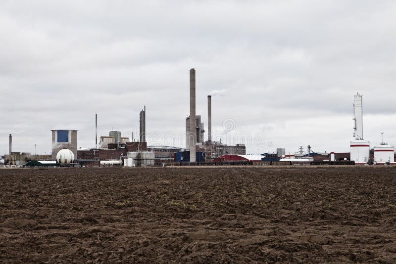 Industrial Buildings Behind a Field Stock Image - Image of exterior ...