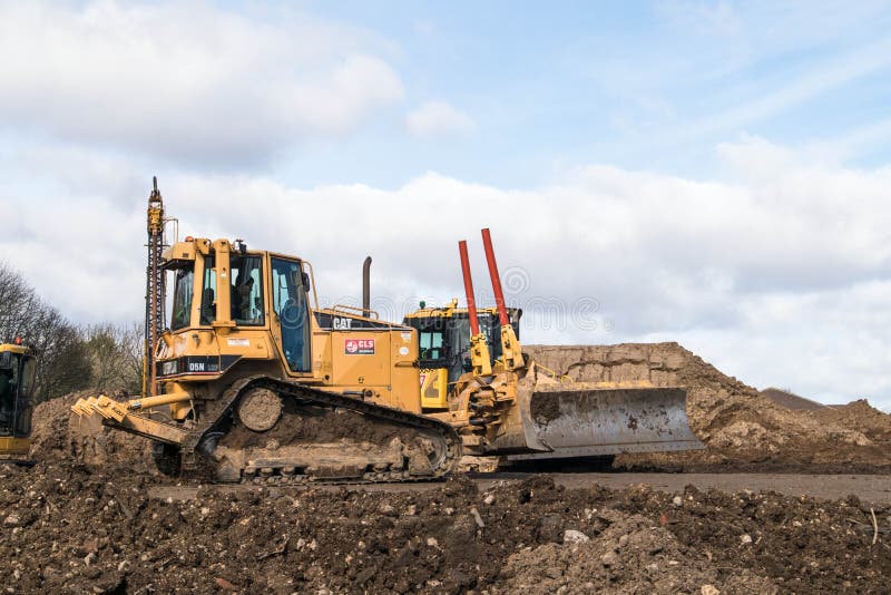 Industrial Bulldozer Moving Earth on a Construction Site Editorial ...