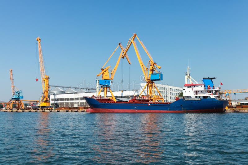 Loading of Big Industrial Cargo Ship in Port Stock Image - Image of ...