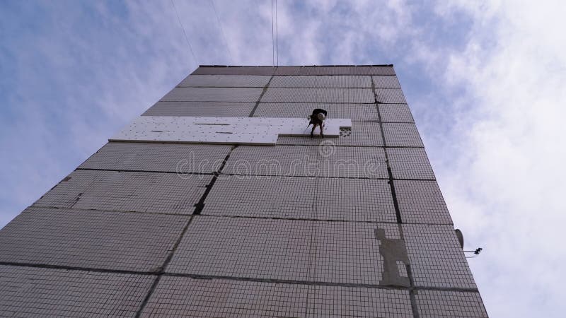 Industrial Climber Insulation of Facade Old High-Rise Building Using ...