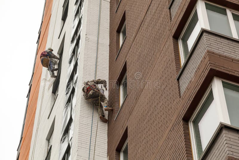 Industrial Climbers Climb on a Facade of the Building Stock Image ...
