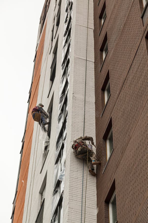 Industrial Climbers Climb on a Facade of the Building Stock Image ...