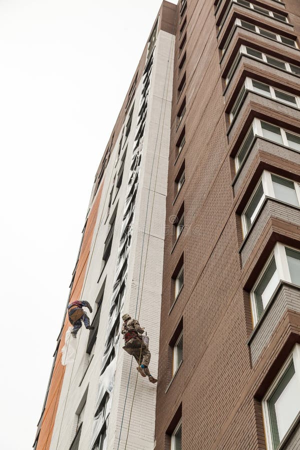 Industrial Climbers Climb on a Facade of the Building Stock Image ...