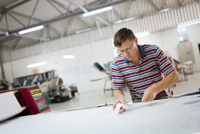 Industrial Clothing Designer Working According To Scheme Stock Photo ...