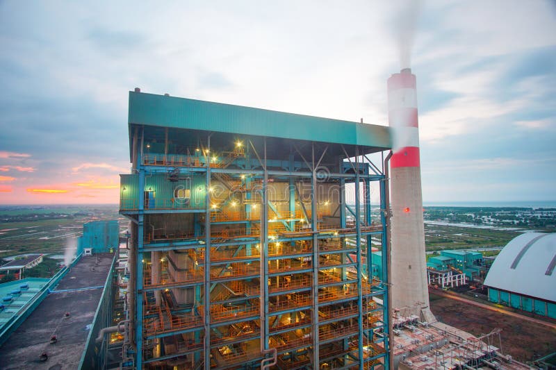 Industrial Complex at Sunset Featuring a Power Plant with Tall Chimney ...