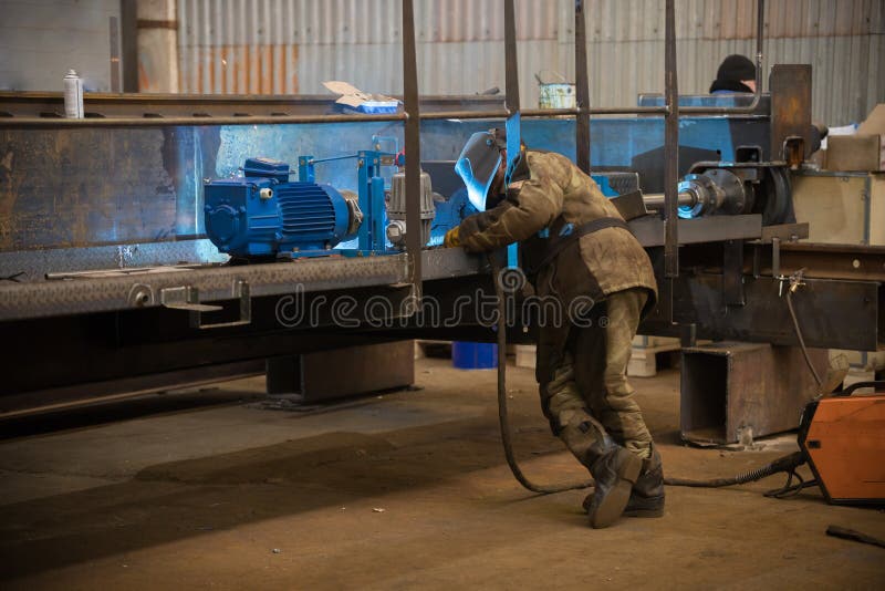 Industrial Concept. a Man Controlling the Process of Manufacturing ...