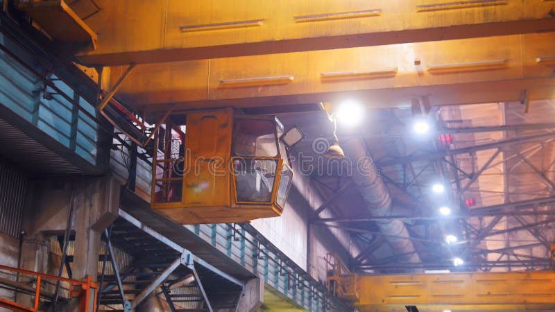 Industrial Concept. a Man Controls the Big Industrial Lifting Crane ...