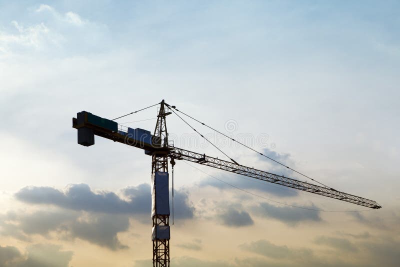 Industrial Construction Cranes on Amazing Sunset Sky Stock Photo ...
