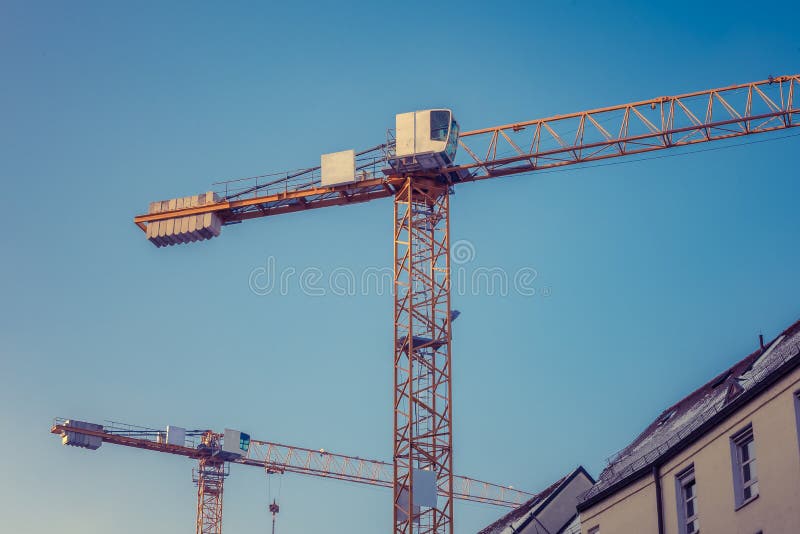 Industrial Construction Cranes and Building in Construction Site Stock ...
