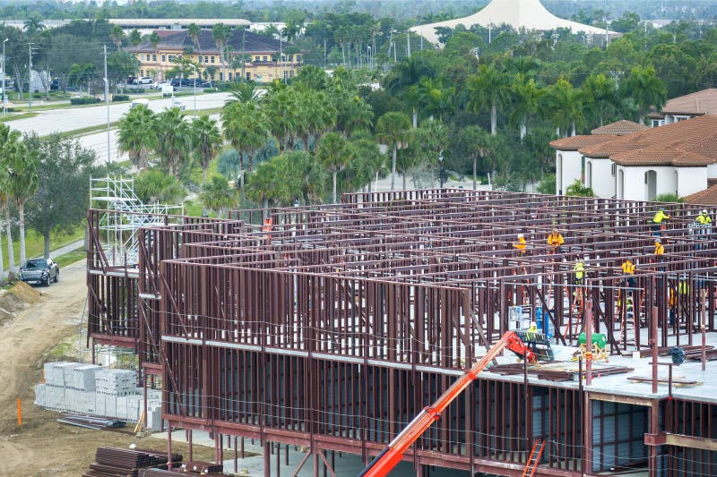 Industrial Construction Site with Workers Assembling Metal Frame ...