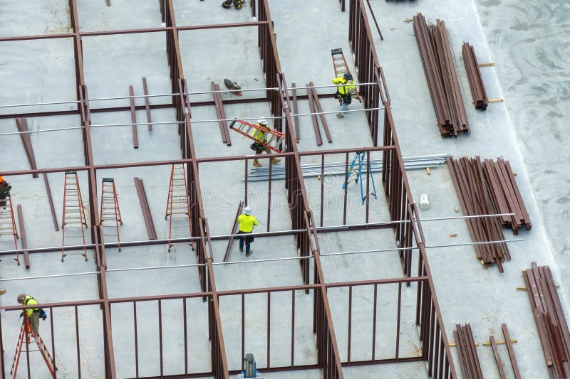 Industrial Construction Site with Workers Assembling Metal Frame ...