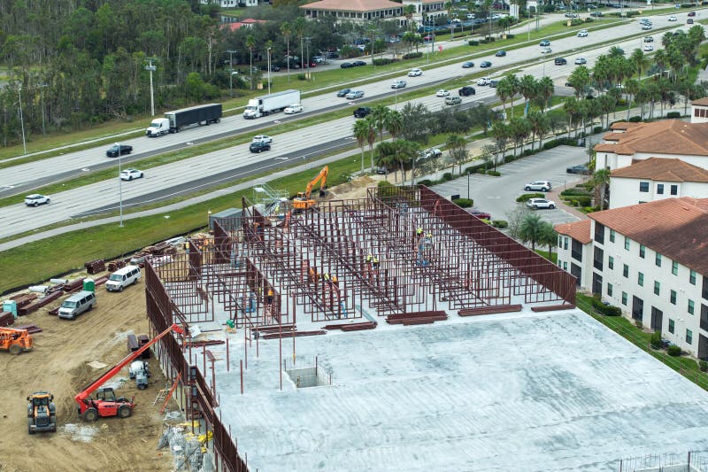 Industrial Construction Site with Workers Assembling Metal Frame ...