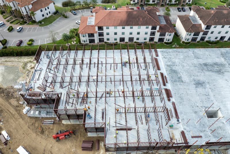 Industrial Construction Site with Workers Assembling Metal Frame ...