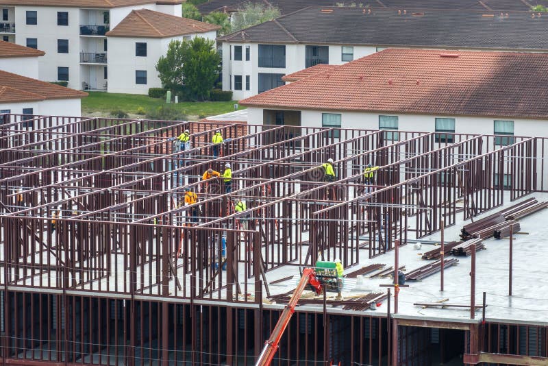Industrial Construction Site with Workers Assembling Metal Frame ...