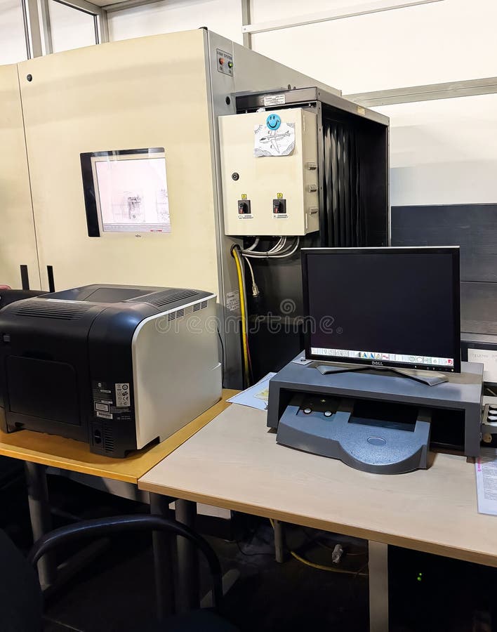 Industrial Control Room with Printer and Computer Setup in Office ...