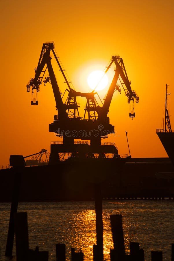 Industrial Cranes at Sunset Stock Photo - Image of cargo, heavy: 5611418