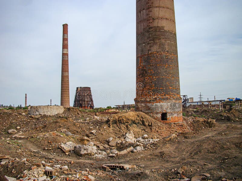 Industrial Decay Scene with Two Deteriorating Structures, Vegetation ...
