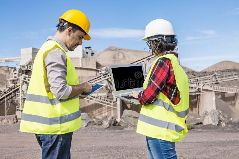 Industrial Developers Working with Gadgets on Construction Site Stock ...