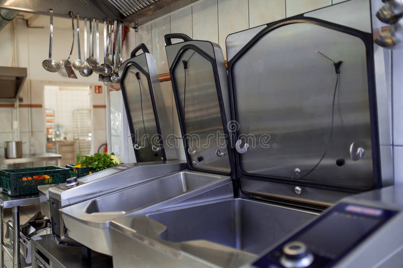 Industrial Dishwasher in Restaurant Kitchen Washing Dishes Stock Photo ...