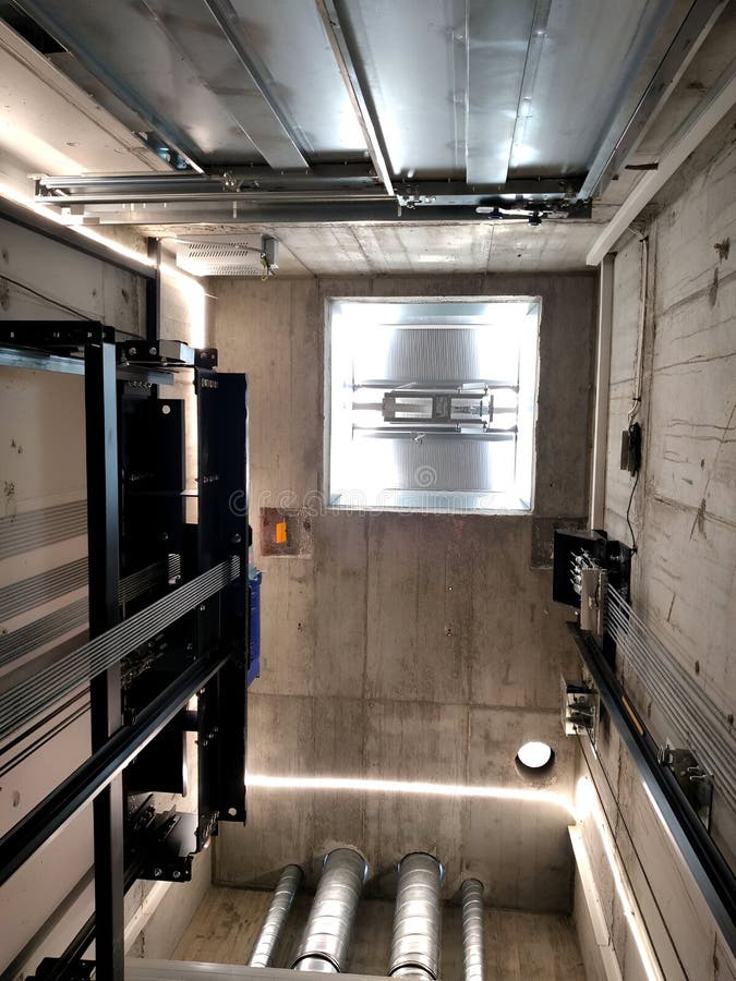 Industrial Elevator Shaft with Metal Pipes and Cables Stock Photo ...