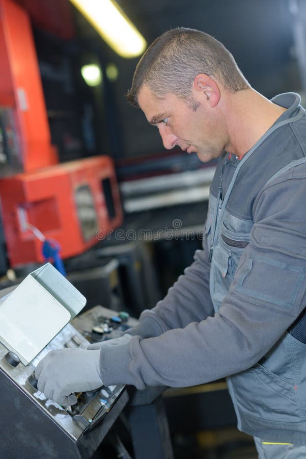 Industrial Engineer Inspecting Machine Stock Photo - Image of revision ...