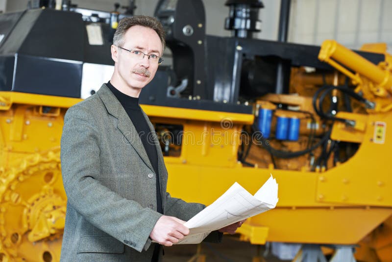 Production Engineer or Industrial Worker with Drawings at Factory Stock ...