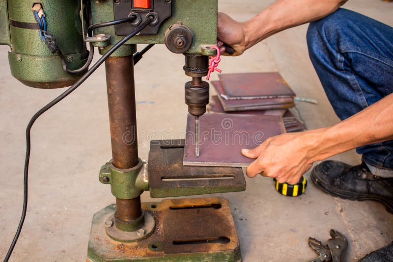 The Industrial Engineer Using a Mechanical Drill Machine Stock Photo ...