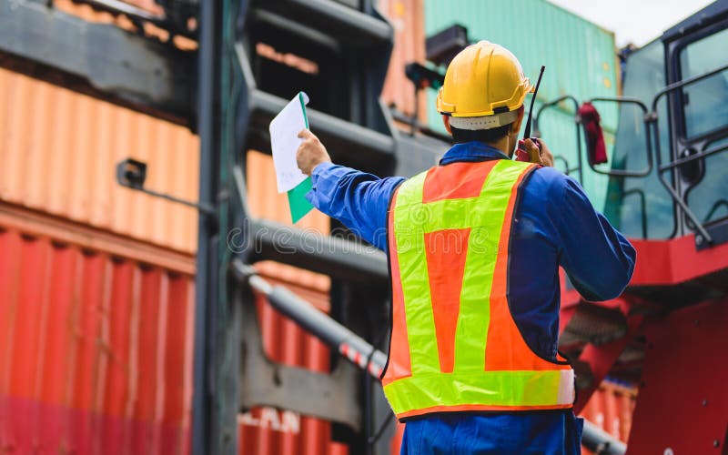 Industrial Engineer Worker Working at Overseas Shipping Container Yard ...