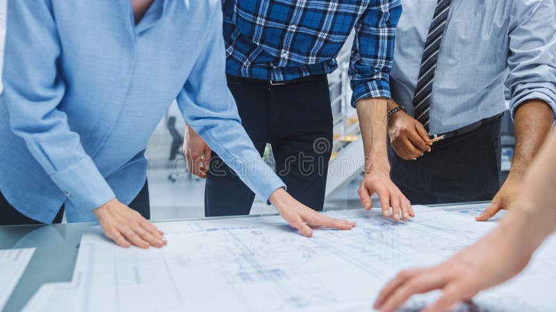 In the Industrial Engineering Facility: Diverse Group of Engineers and ...