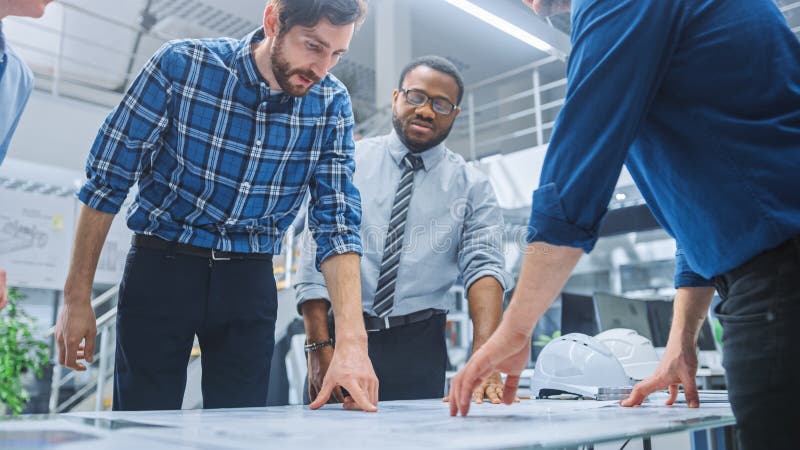 In the Industrial Engineering Facility: Diverse Group of Engineers and ...
