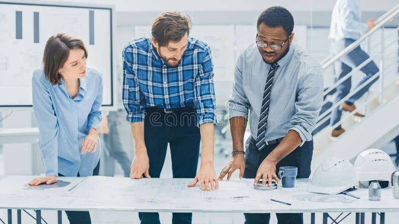 In the Industrial Engineering Facility: Diverse Group of Engineers and ...