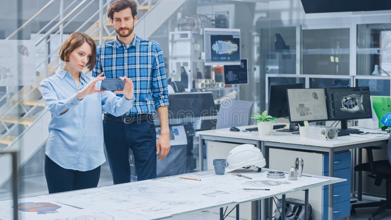 In the Industrial Engineering Facility: Female Designer with Chief ...